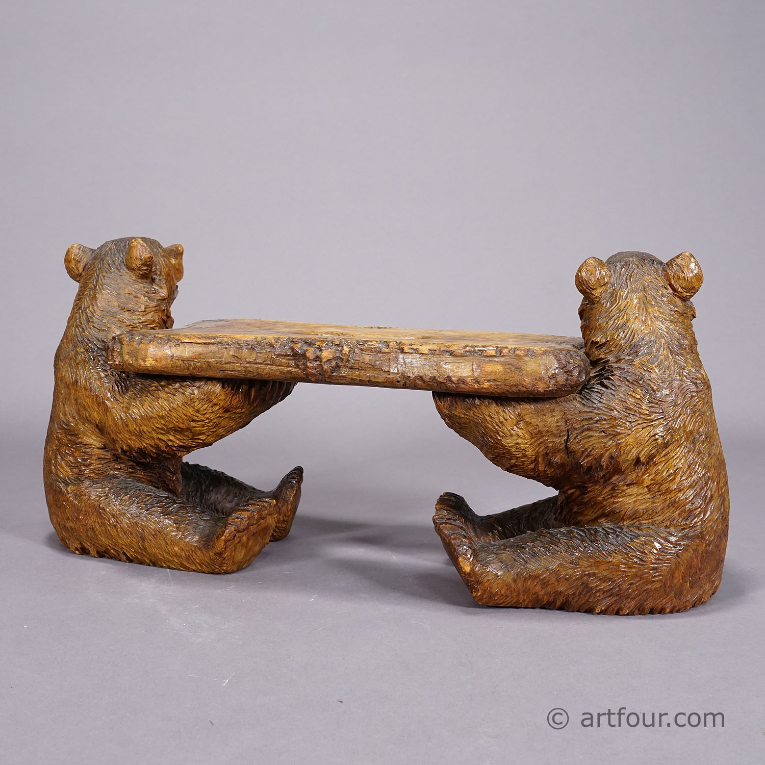 A wooden carved Black Forest bear bench, ca. 1900s